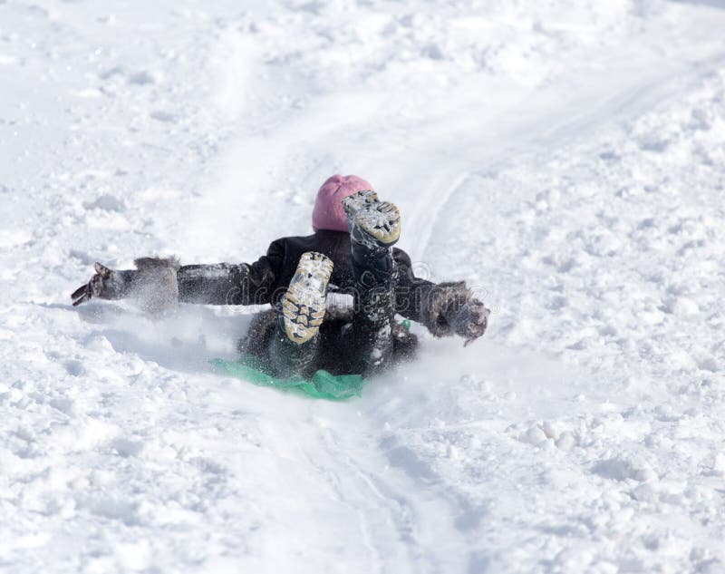The Child Rolls Down the Hill in Winter Stock Photo - Image of active ... The Child Rolls Down the Hill in Winter Stock Photo - Image of active ...
