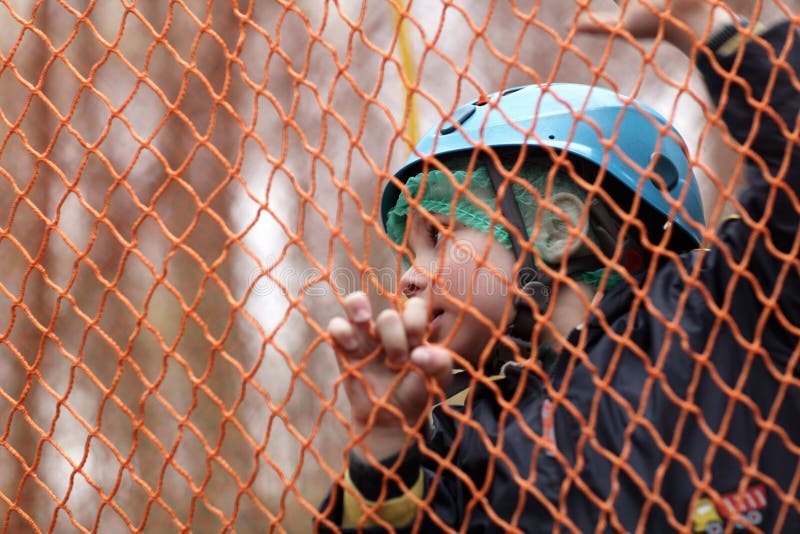 Child on a rope net stock photo. Image of male, hanging - 53731522