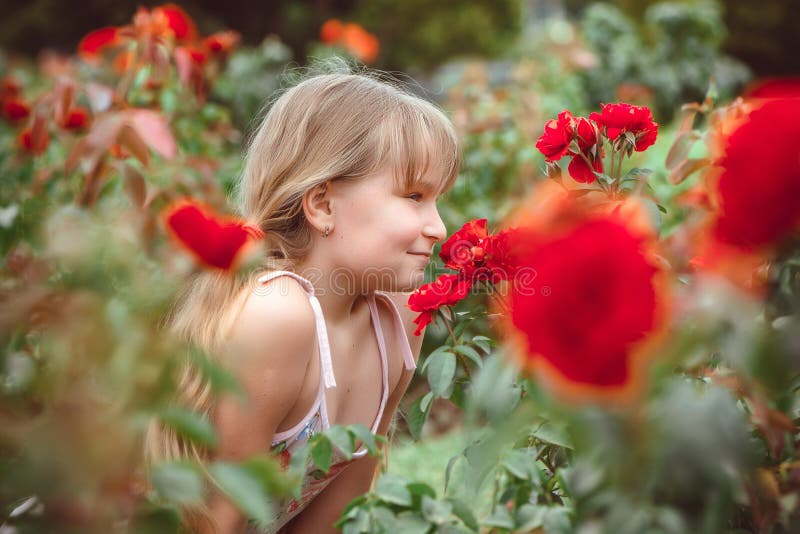Child with Rose Flower in Spring Garden Stock Image - Image of holding ...