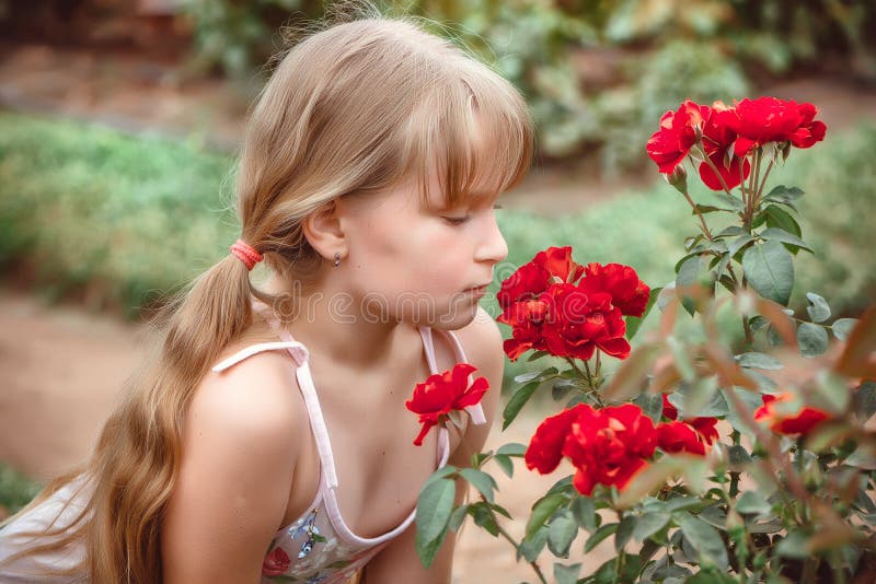 Child with Rose Flower in Spring Garden Stock Image - Image of person ...
