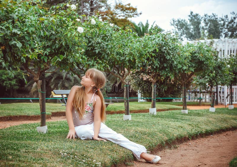 Child with Rose Flower in Spring Garden Stock Image - Image of person ...