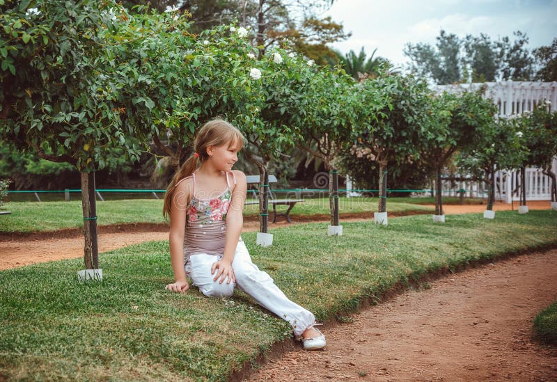 Child with Rose Flower in Spring Garden Stock Image - Image of ...