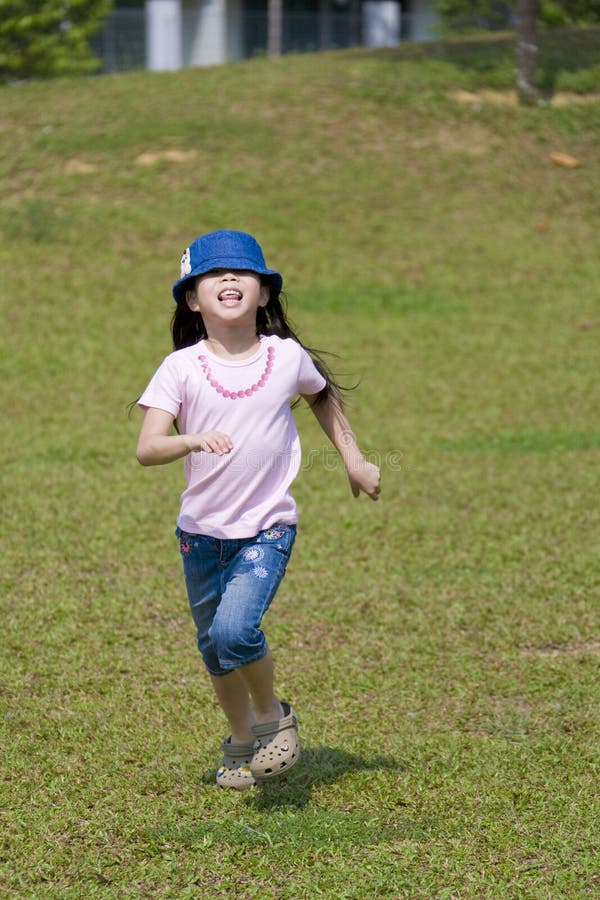 Child Running stock photo. Image of chinese, playing, ground - 9619478