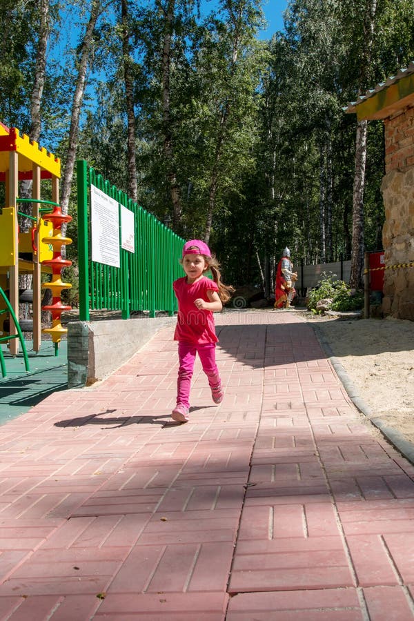 The Child is Running Around the Playground Stock Image - Image of park ...