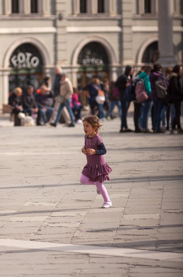 Child Running in the Square Editorial Photography - Image of happy ...