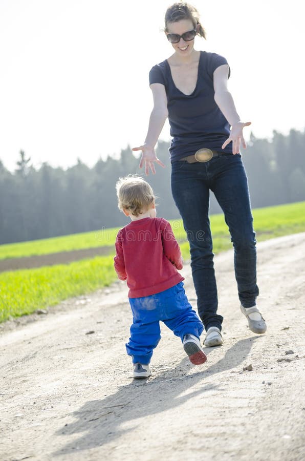 Child running to his mum stock photo. Image of parent - 31487416
