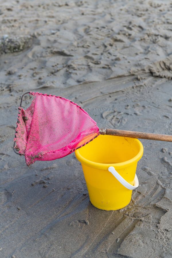Bucket and Fishing Net on a Beach Stock Image - Image of outdoor ...