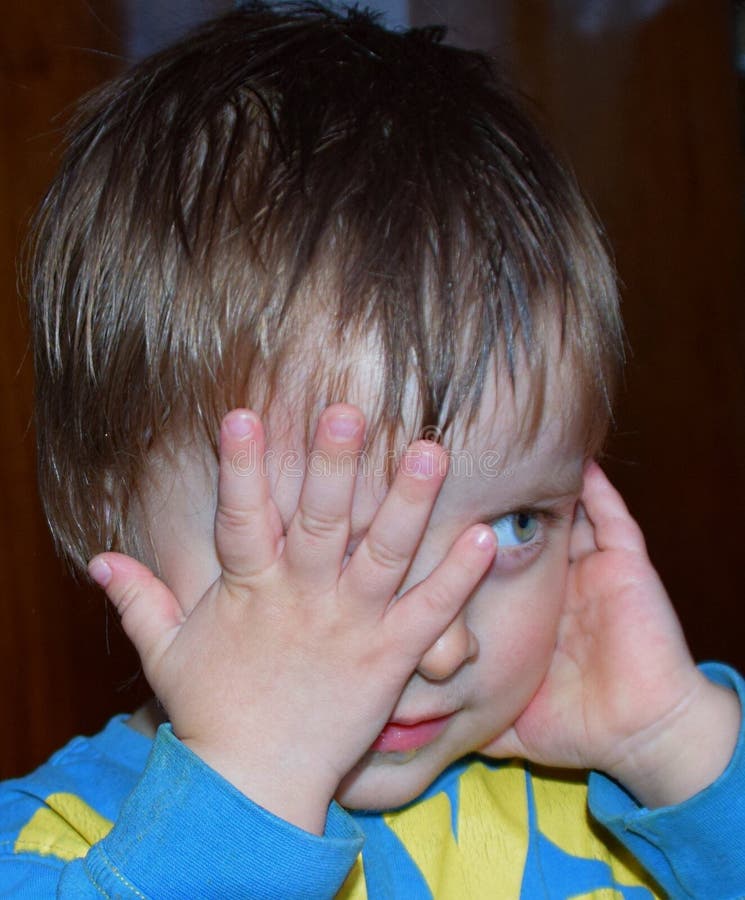 Child s covering the face stock image. Image of covering - 79591757