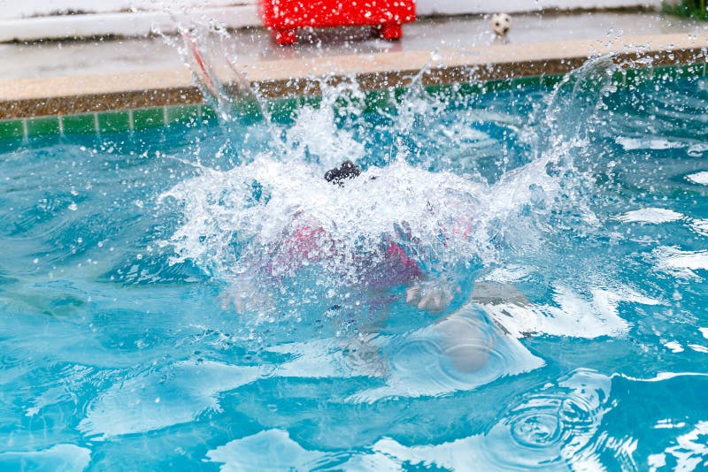 Boy Helping Drowning Child Girl in Swimming Pool by Doing CPR. Stock ...
