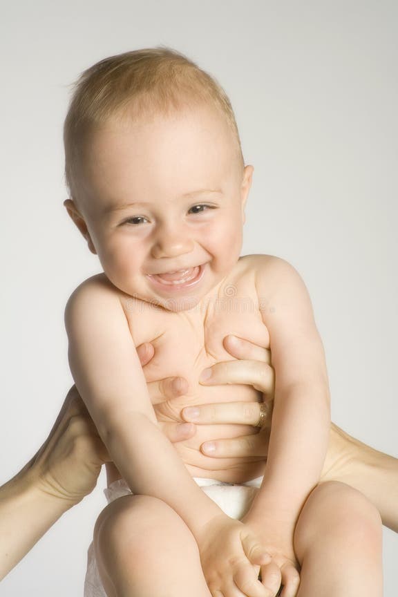 ChildÂ´s giggling stock image. Image of babies, affection - 1341777