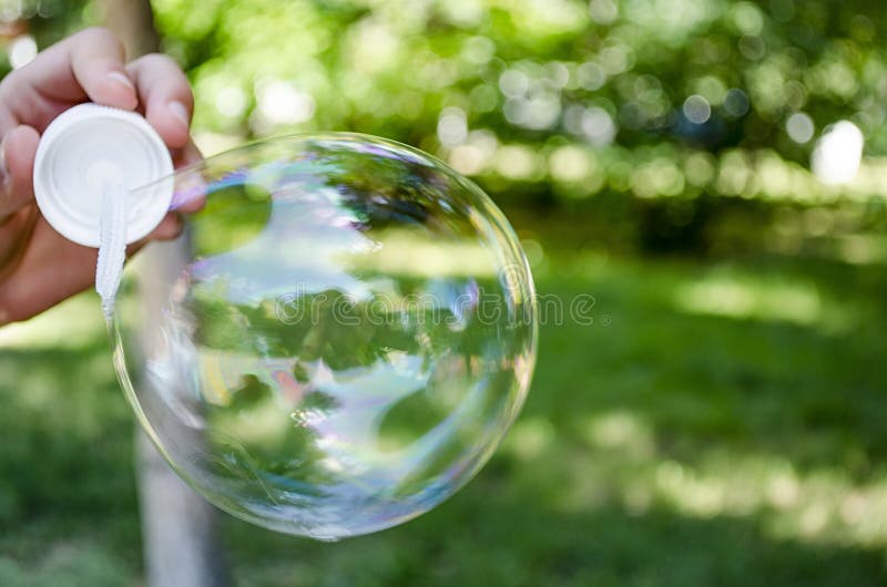 A Child`s Hand and the Bubble Stock Photo - Image of soap, summer: 95638124