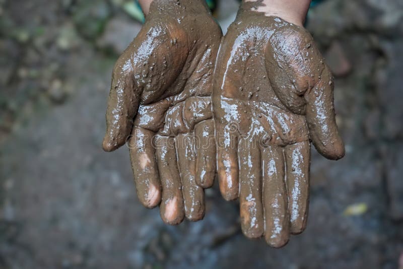 A Child& X27;s Hand Full of Mud Stock Photo - Image of organ, relief ...