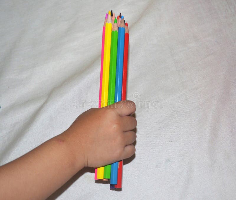 Child& X27;s Hand Holding Colored Pencils Stock Photo - Image of blank ...