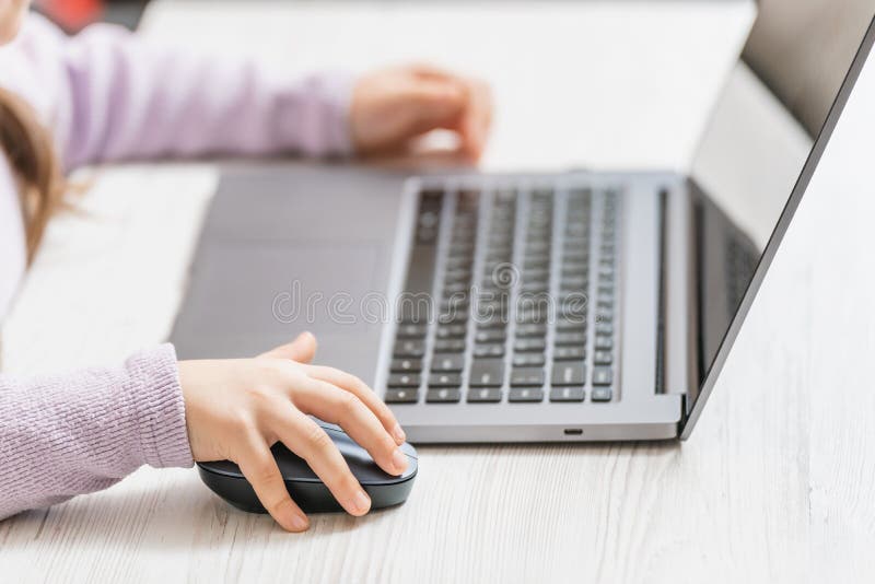 Child`s Hand Holds a Computer Mouse, Child Learns and Plays on the ...