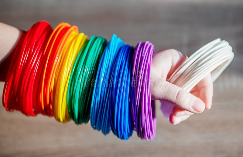 A Child S Hand Holds a Multi-colored Plastic for Creativity. Materials ...