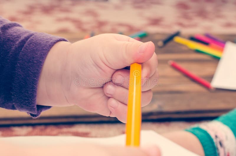 Child`s Hand Holds a Yellow Pencil Stock Image - Image of hand ...