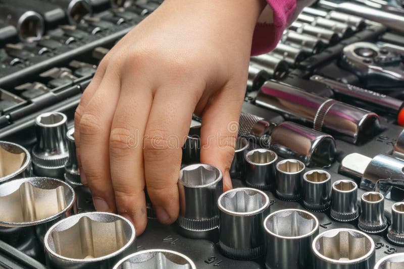 Child S Hand Picking Up Socket Wrench Head from Tool Kit Stock Image ...