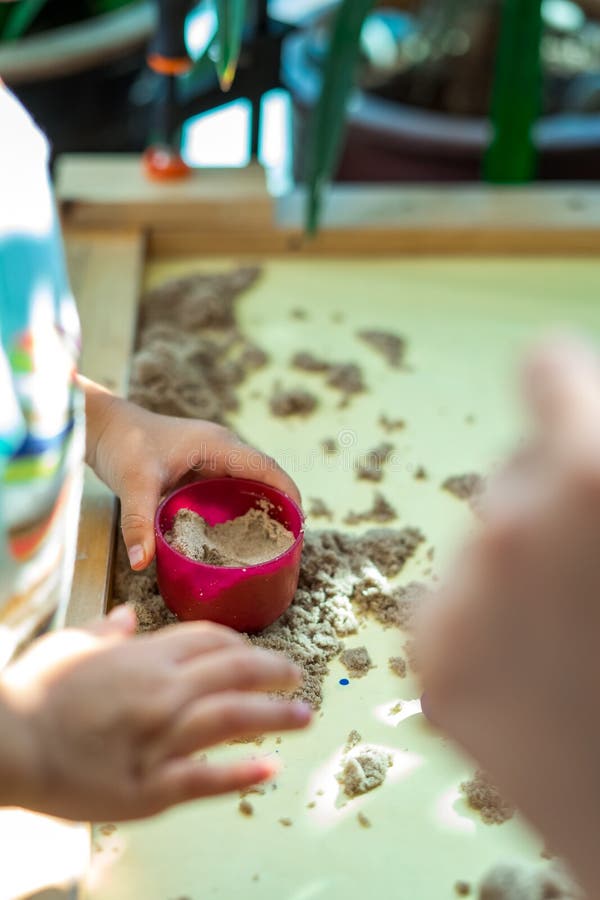 Child`s Hand Playing with Kinetic Sand in Preschool. the Development of ...