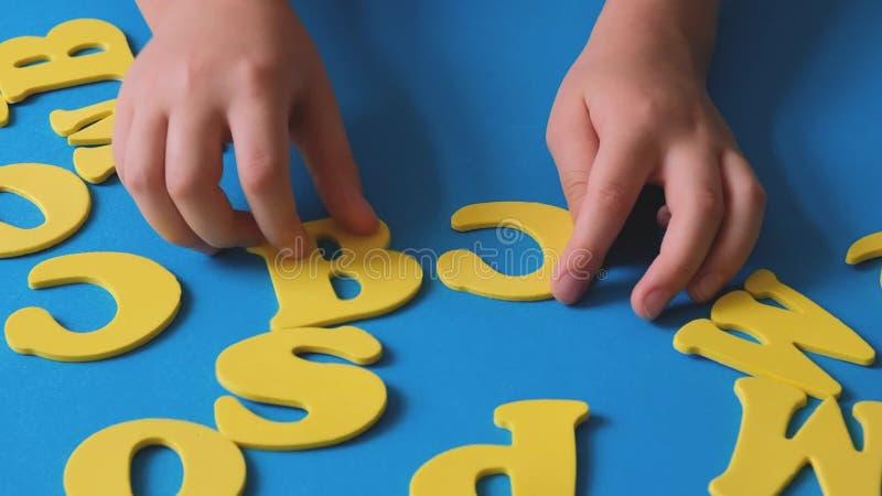 Child S Hand Playing with Letters of the Alphabet Stock Footage - Video ...