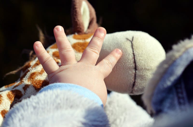 Child S Hand Playing on Toy Stock Photo - Image of little, person: 50910270