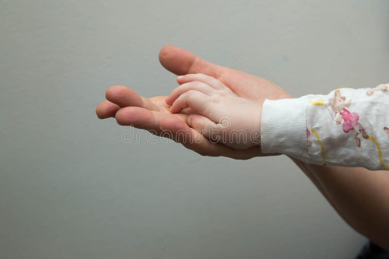 Child's Hand Rests Palm Adult Stock Photos - Free & Royalty-Free Stock ...