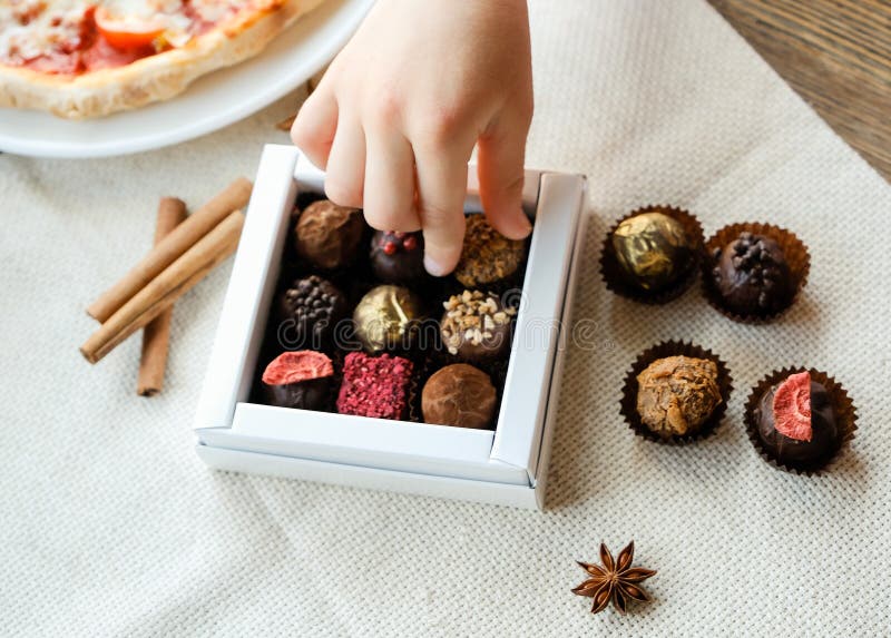 Child`s hand take a sweet stock image. Image of child - 116400567