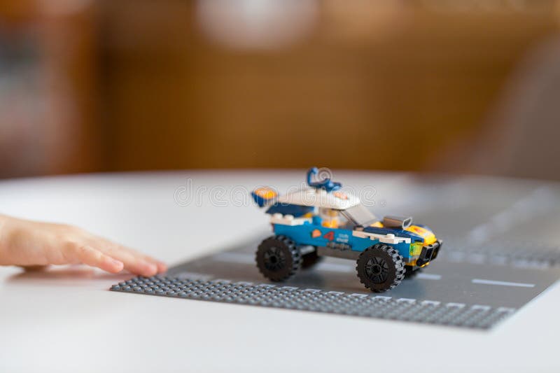 A Child S Hand and a Toy Car Made of Blocks. Stock Photo - Image of ...