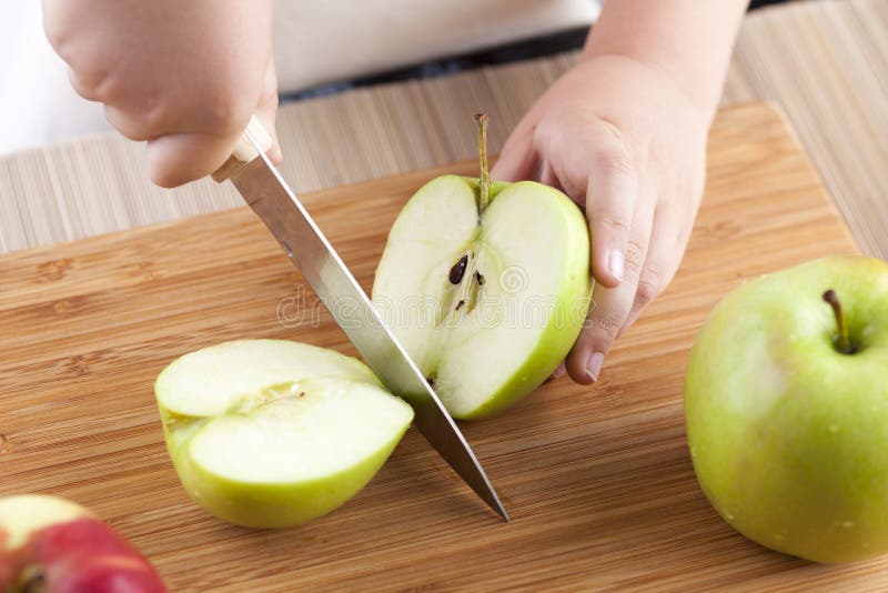 Child S Hands Cutting Apple Stock Image - Image of human, freshness ...