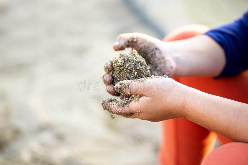 Child`s Hands and Dumpling Sand in Sandbox and Copy Space Stock Photo ...