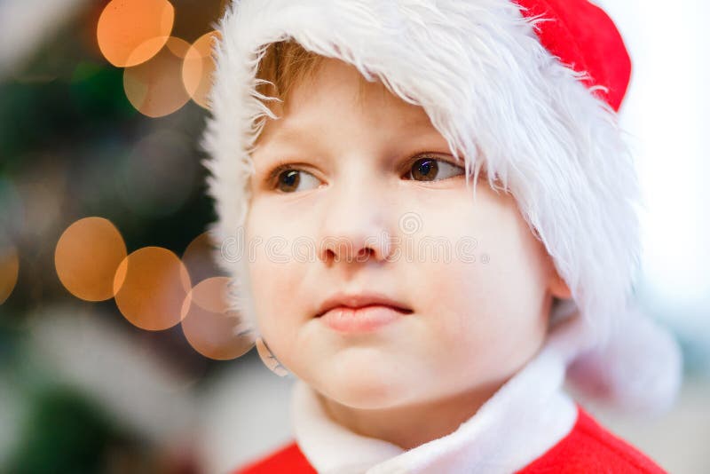 The Child`s Head in a Red Santa Hat Stock Image - Image of happiness ...