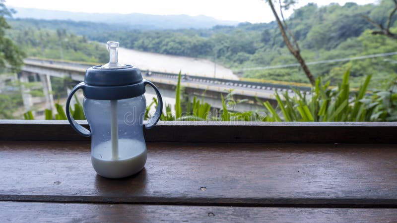 Child`s Pacifier on Table with View of Bridge Stock Photo - Image of ...
