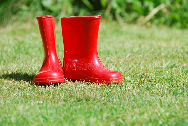 Child s red rubber boots 2 stock image. Image of bright - 5610807