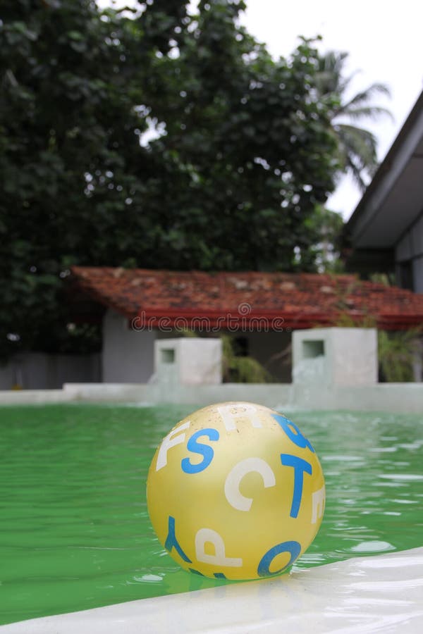 Child`s Yellow Ball Floating in Pool Stock Photo - Image of relax ...