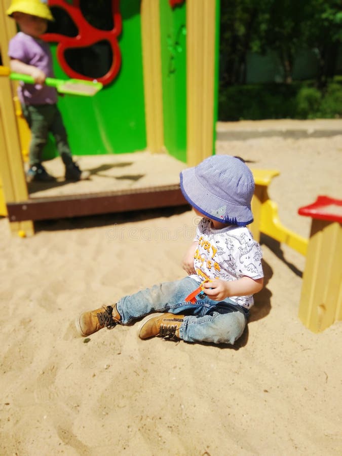 Child in the sandbox stock image. Image of outdoors, playground - 5689977