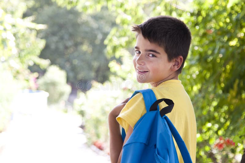 Child with school bag stock photo. Image of learning - 77569772