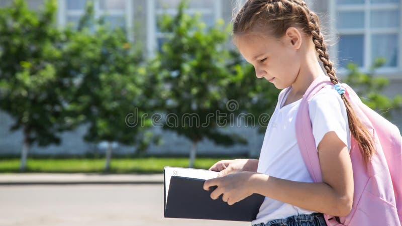 Child School Girl Doing Homework on the Stairs of the School Yard Stock ...