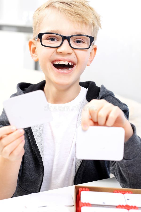 Child at School. Learning To Read. the Child is Writing Words. Stock ...