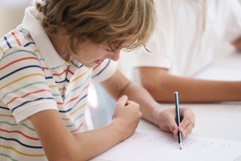 Child in School. Student in Class. Boy at Homework Stock Image - Image ...