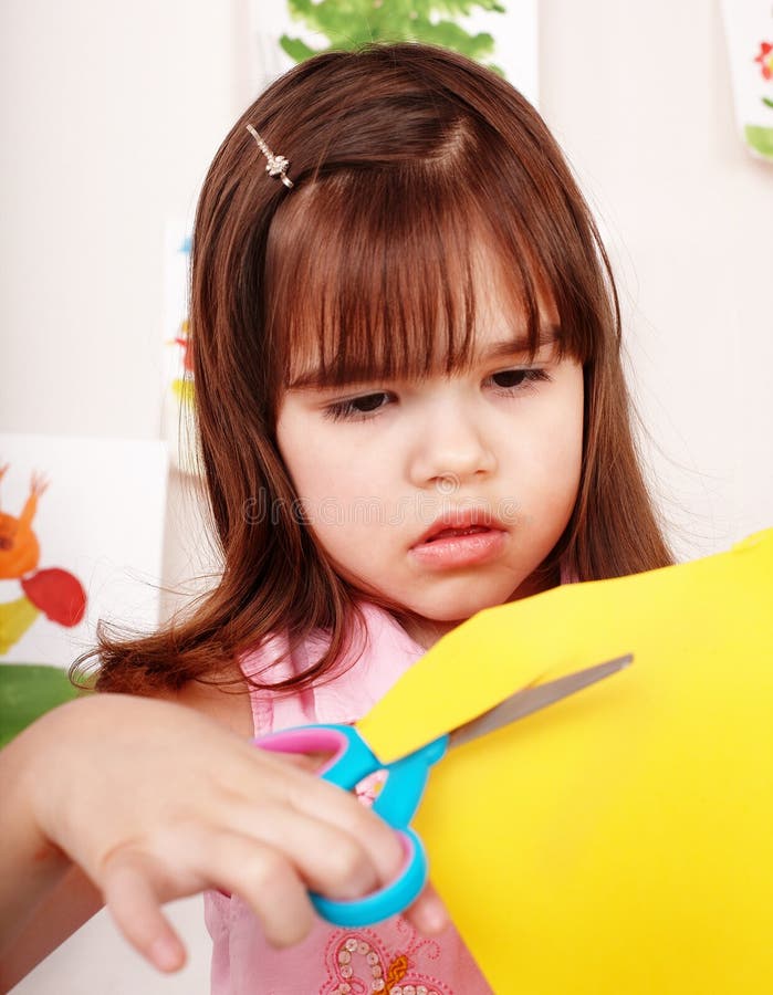 Child with Scissors Cut Paper in Play Room. Stock Photo - Image of ...