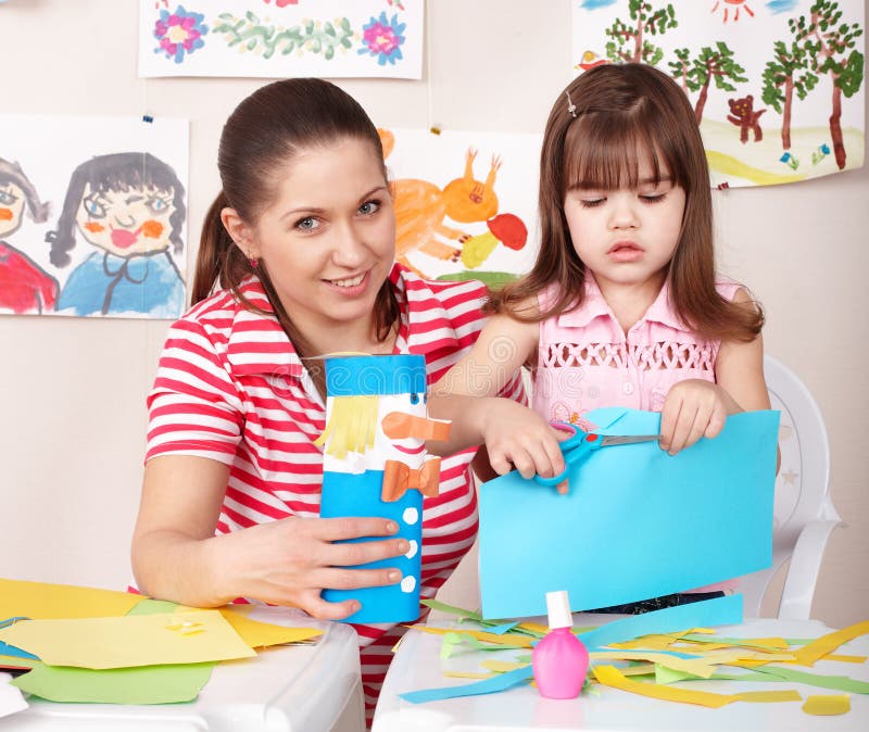 Child with Scissors Cut Paper in Play Room. Stock Photo - Image of ...