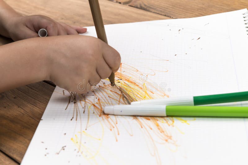 Child Scribbling in a Notebook. Stock Photo - Image of notebook ...