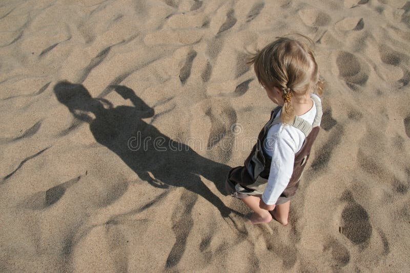 Child and shadow stock photo. Image of beach, children - 1202722