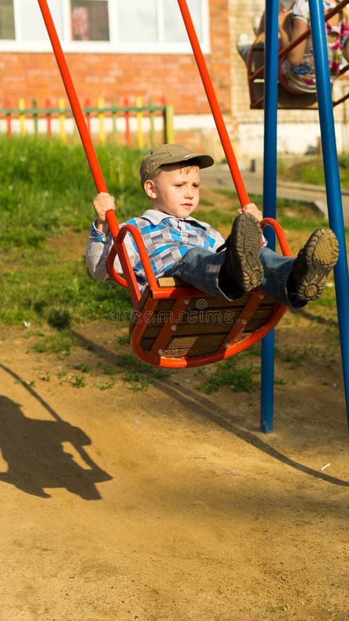 The Child Shakes on a Swing Stock Image - Image of grow, court: 41765345
