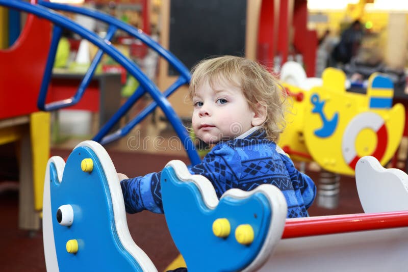 Child Shaking at Indoor Playground Stock Image - Image of portrait ...
