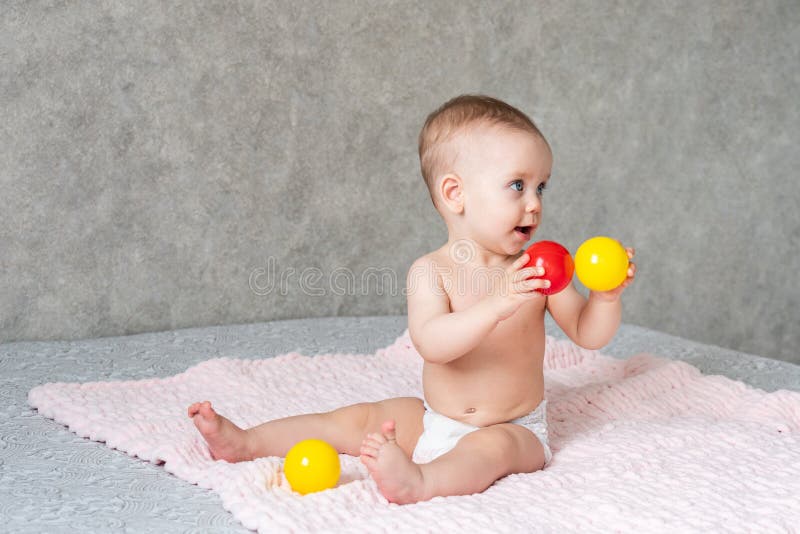 A Child Shows Someone the Colored Balls he Plays with Stock Photo ...