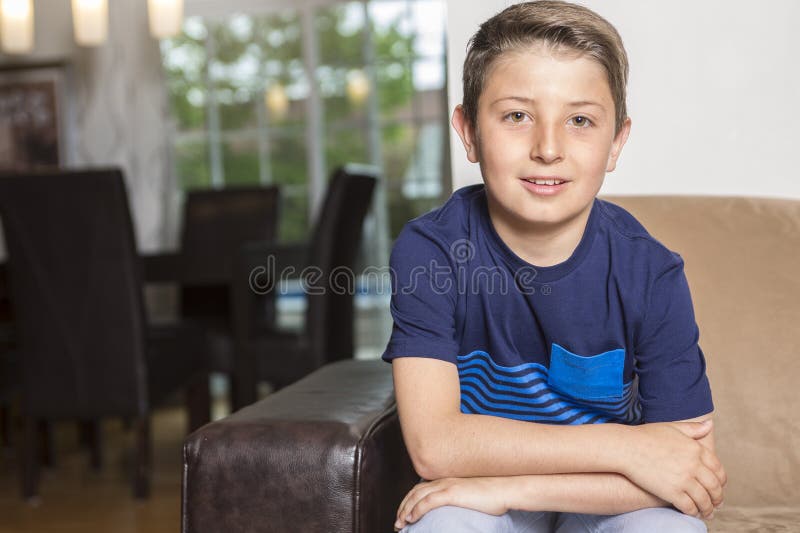 Child sit on sofa at home stock photo. Image of caucasian - 74551052