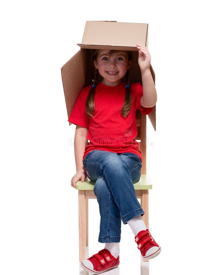 Child Sitting on a Chair with Big Box Covered Head Stock Photo - Image ...