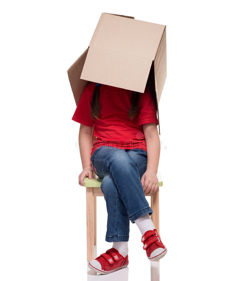 Child Sitting on a Chair with Big Box Covered Head Stock Image - Image ...