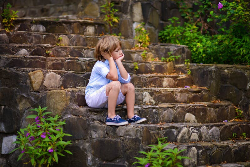 Child sitting on steps stock photo. Image of mountain - 60655670
