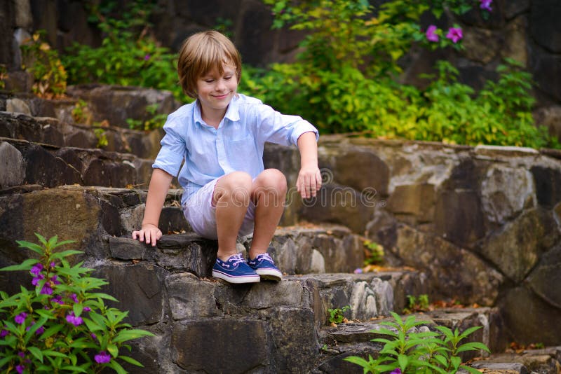 Child sitting on steps stock photo. Image of mountain - 60655670